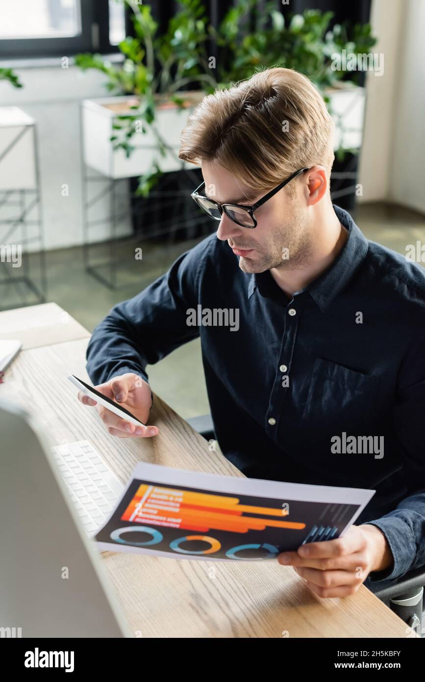 Young programmer holding document hi-res stock photography and images ...
