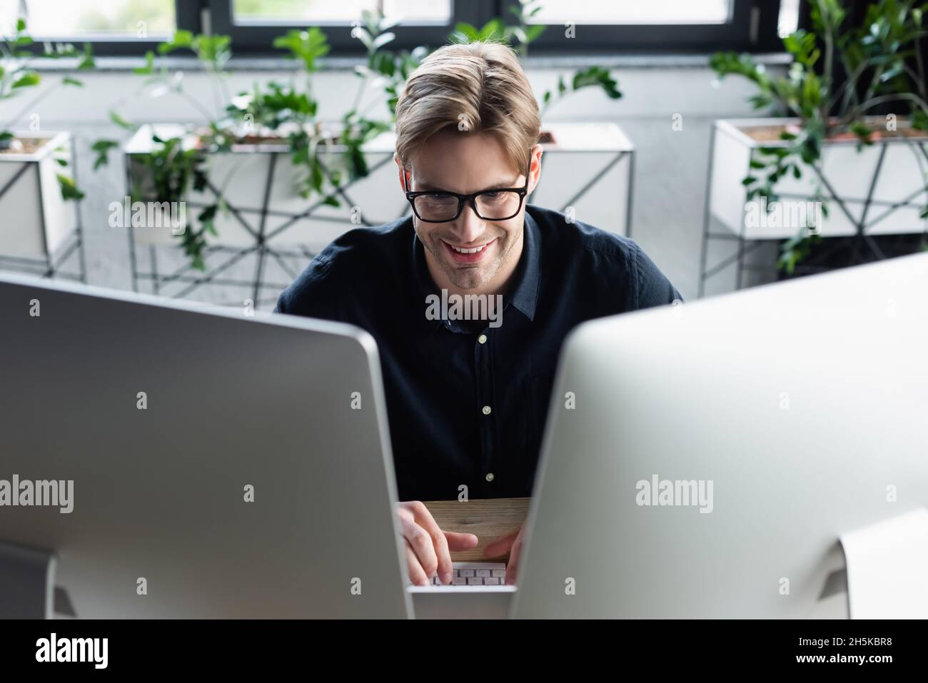 Happy programmer hi-res stock photography and images - Alamy