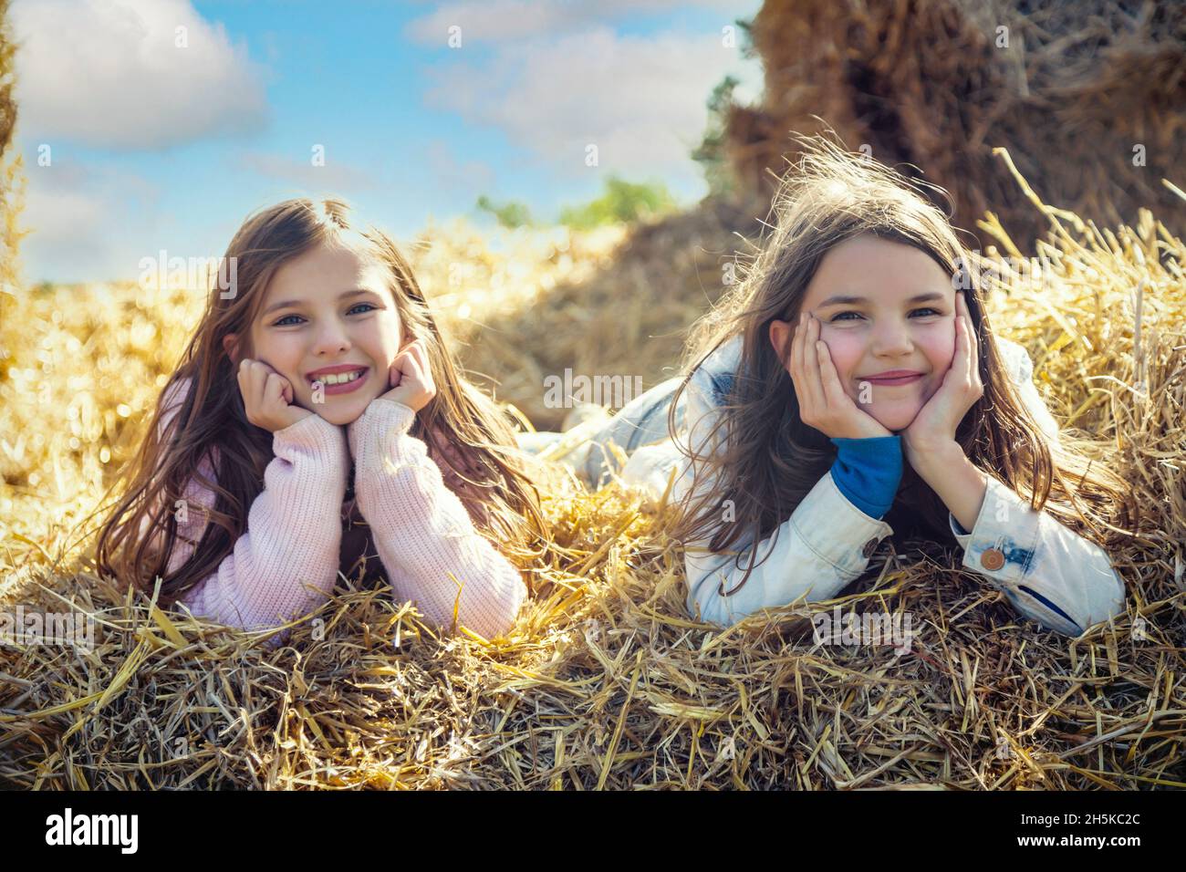 Portrait girl lying on hay hi-res stock photography and images - Alamy