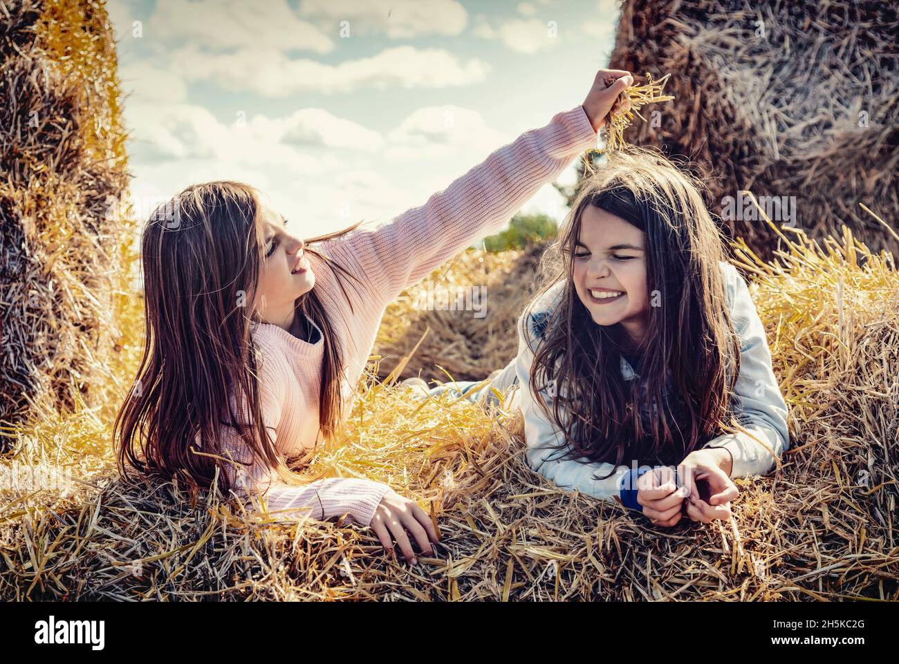 Portrait girl lying on hay hi-res stock photography and images - Alamy