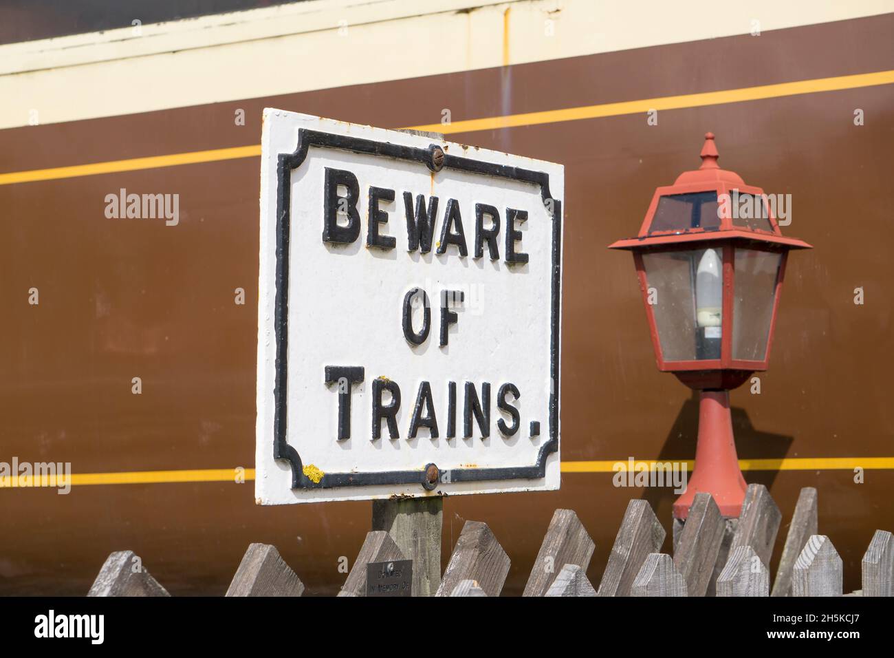 Vintage platform sign at UK heritage railway station warning passengers ...