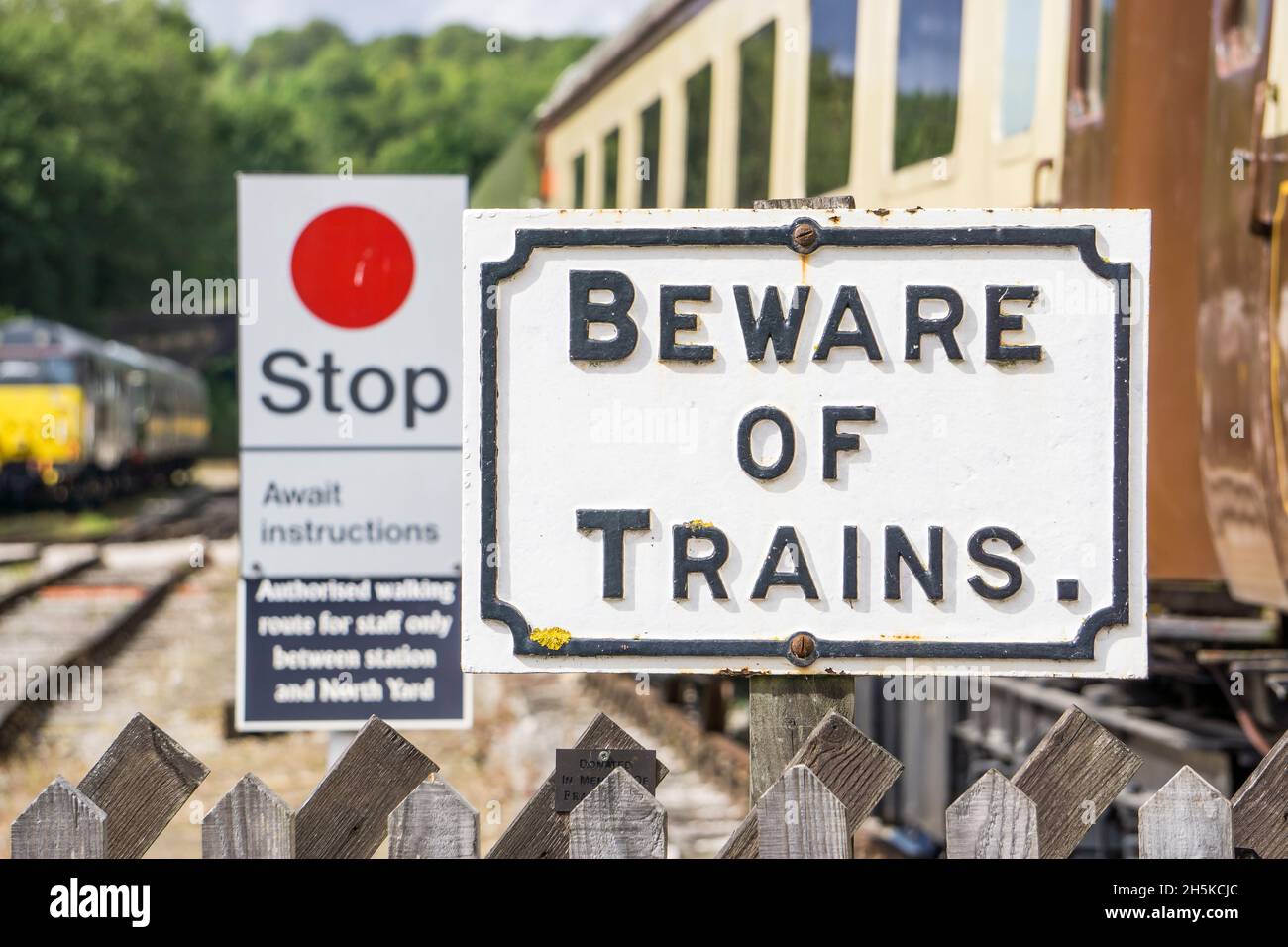 Vintage beware of trains sign Stock Photo - Alamy