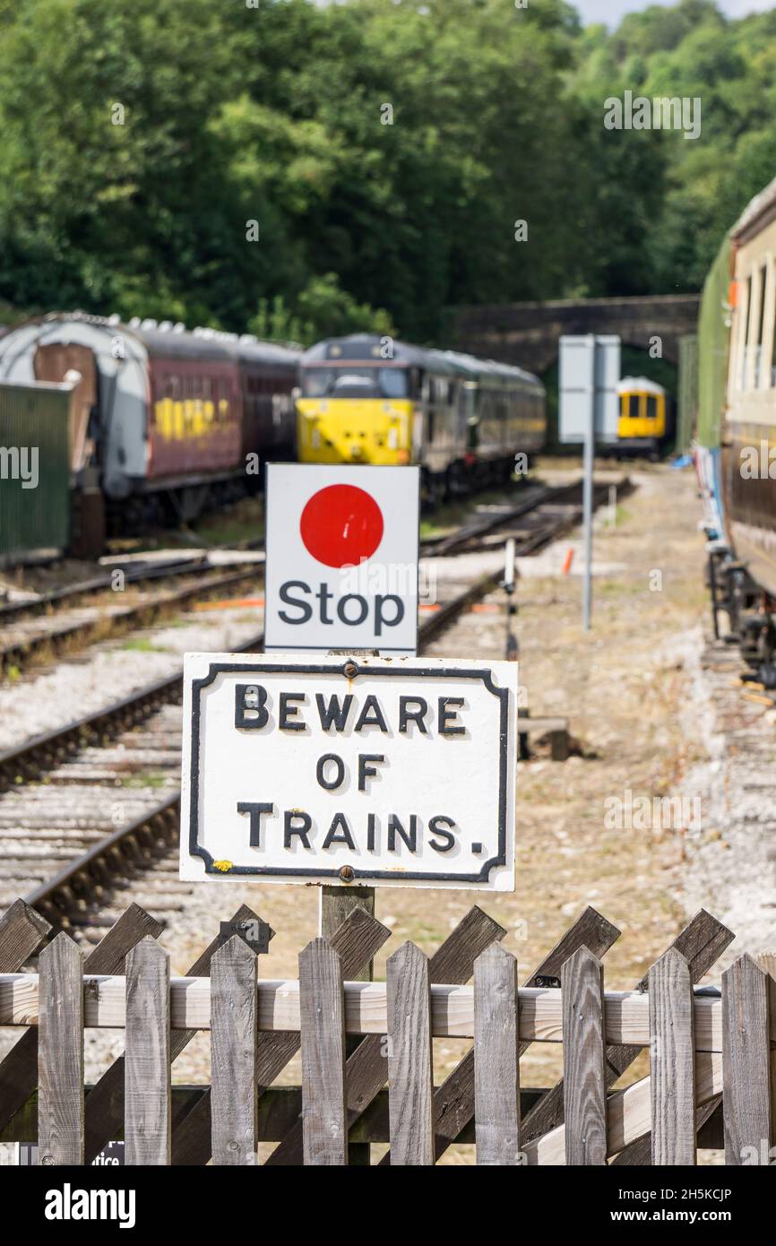 Vintage beware of trains sign Stock Photo - Alamy