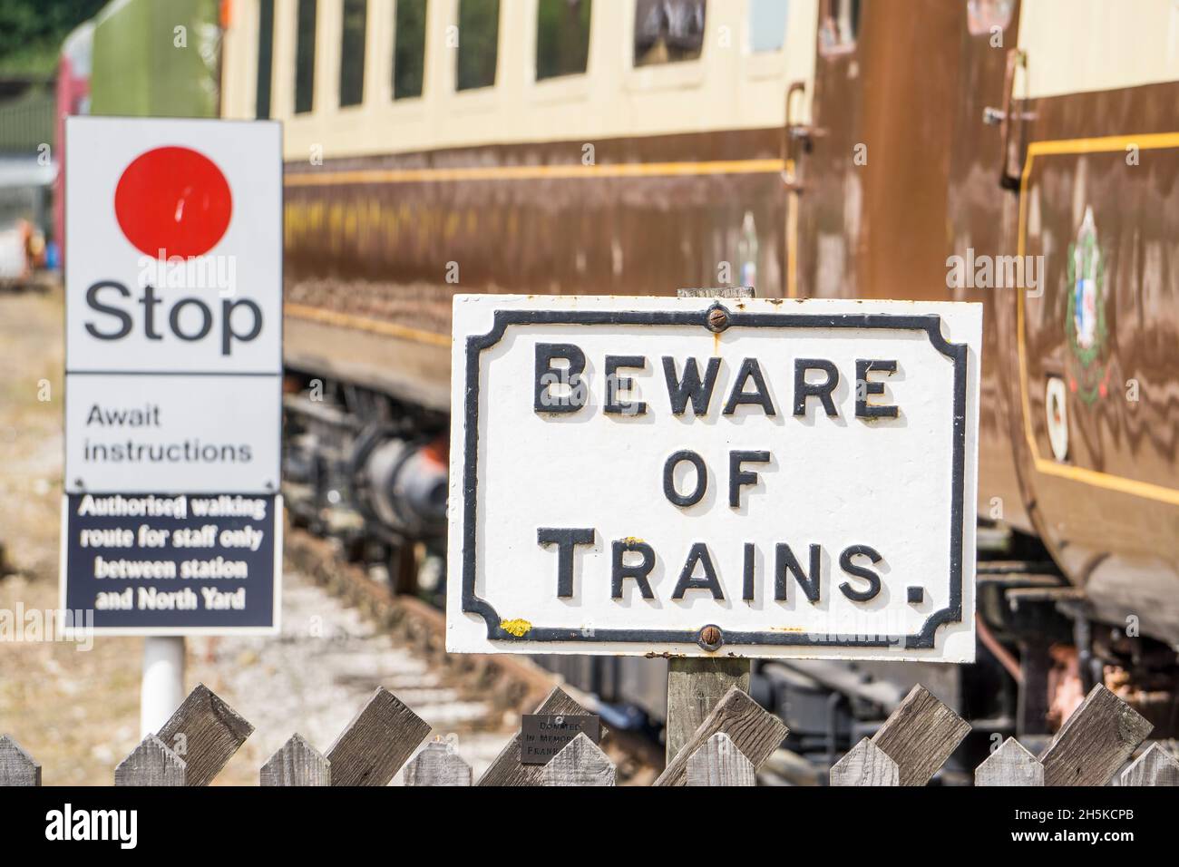 Vintage beware of trains sign Stock Photo - Alamy
