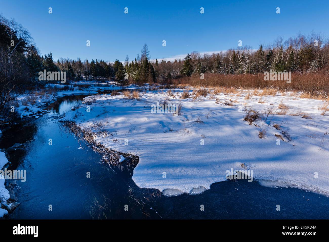 Winter landscape with open water on a pond; Quebec, Canada Stock Photo ...
