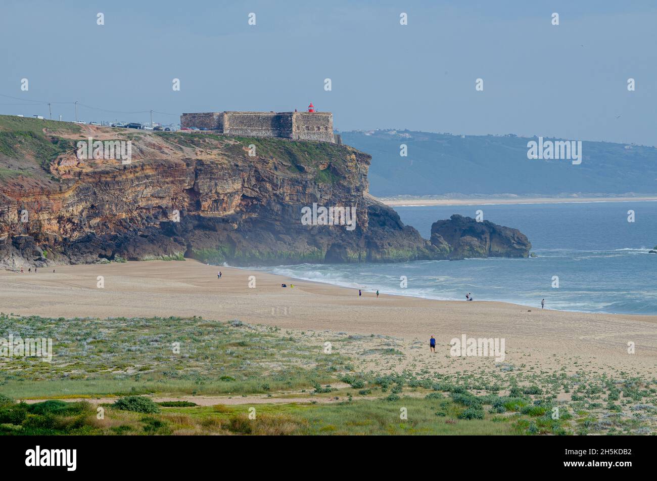 Praia do Norte beach, cliffs and Nazare lighthouse cape.Portugal Stock ...