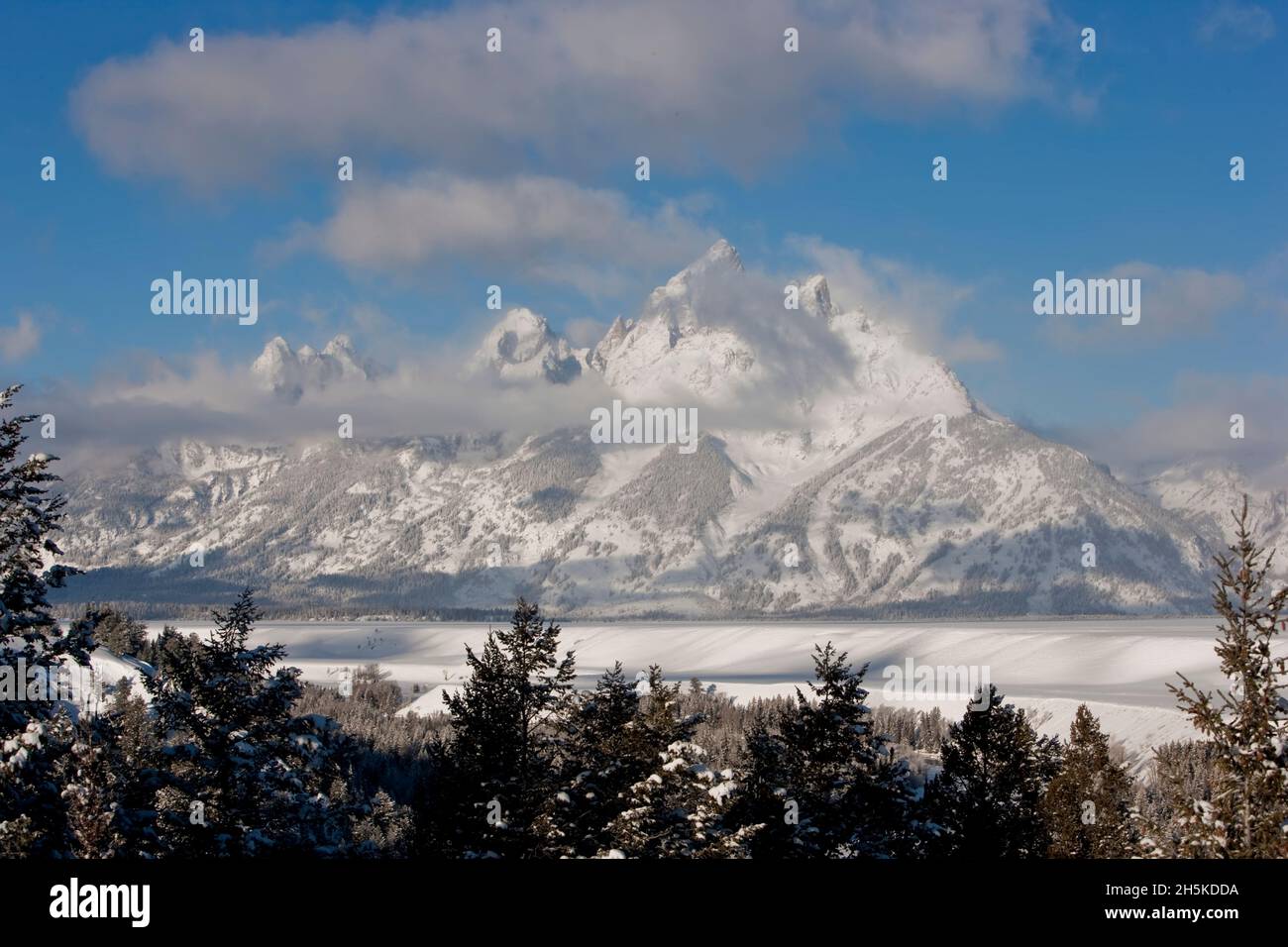 Snow covered Grand Tetons in Grand Teton National Park with a blue sky ...