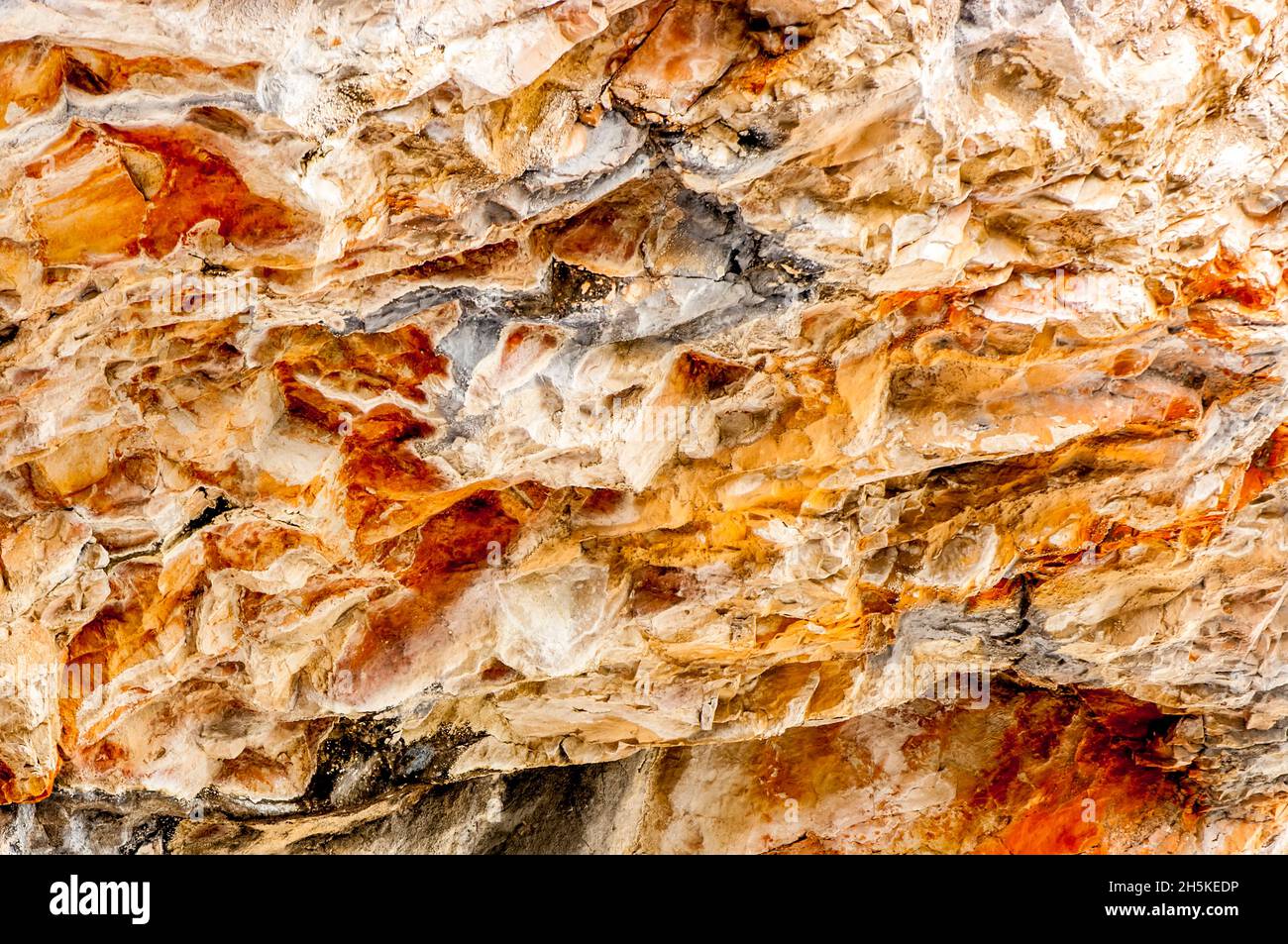 Abstract of golden colored, limestone rock; Yellowstone National Park ...