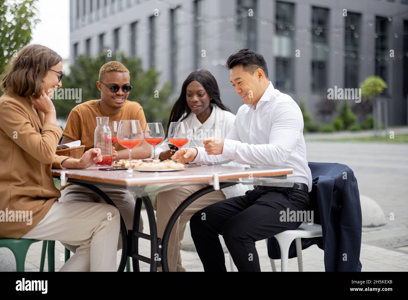 Business team having lunch at outdoor cafe Stock Photo - Alamy