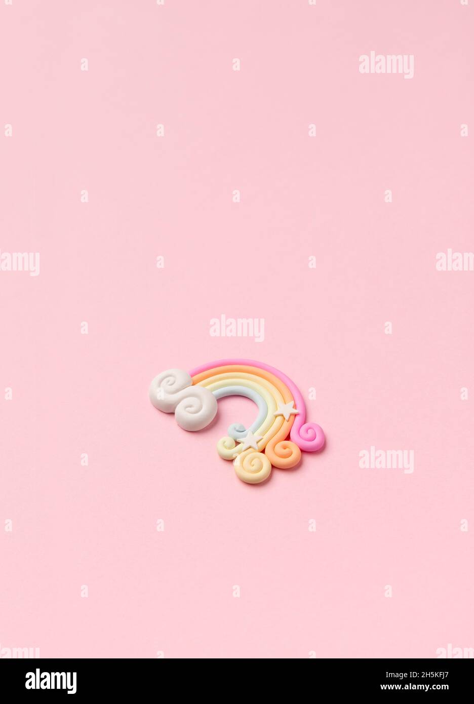 Rainbow pastel color arc on light pink background Stock Photo - Alamy