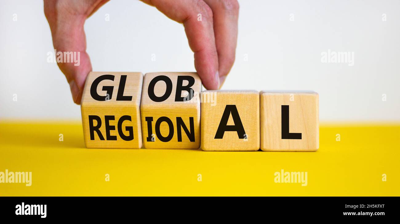 Regional or global symbol. Businessman turns wooden cubes and changes ...