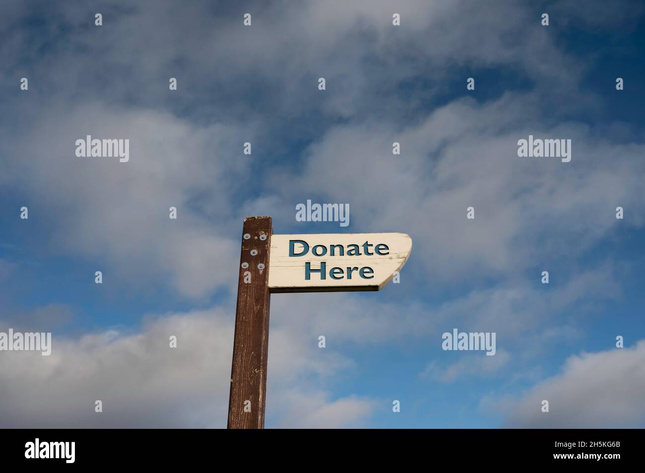 Donate here sign hi-res stock photography and images - Alamy