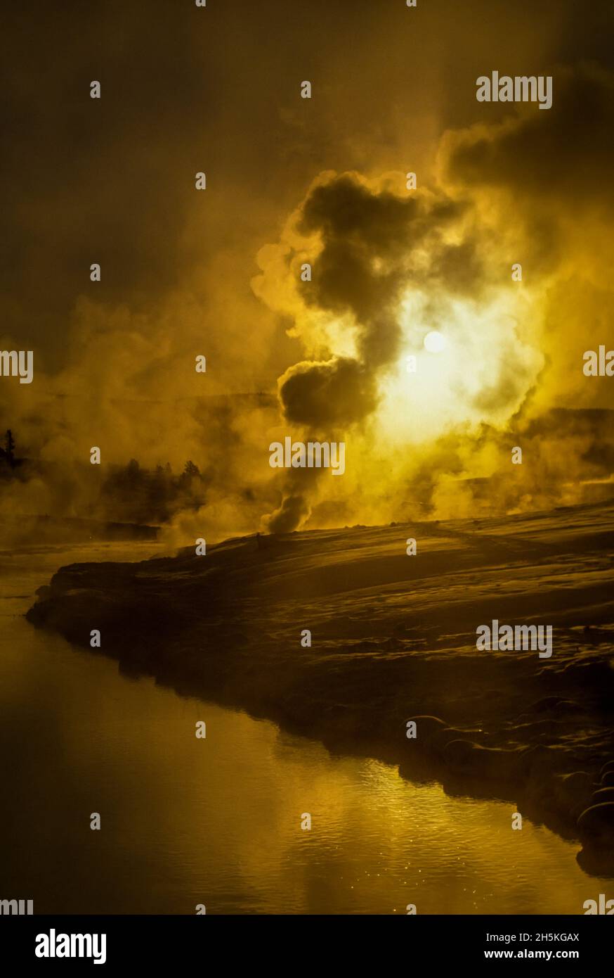 Steam rises from Sprinkler Geyser in the Upper Geyser Basin in the ...