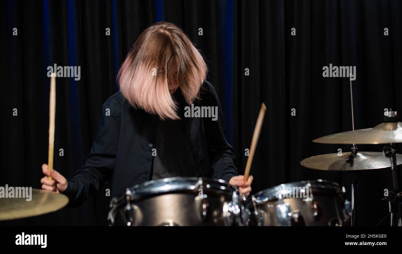 Woman playing drums hi-res stock photography and images - Alamy