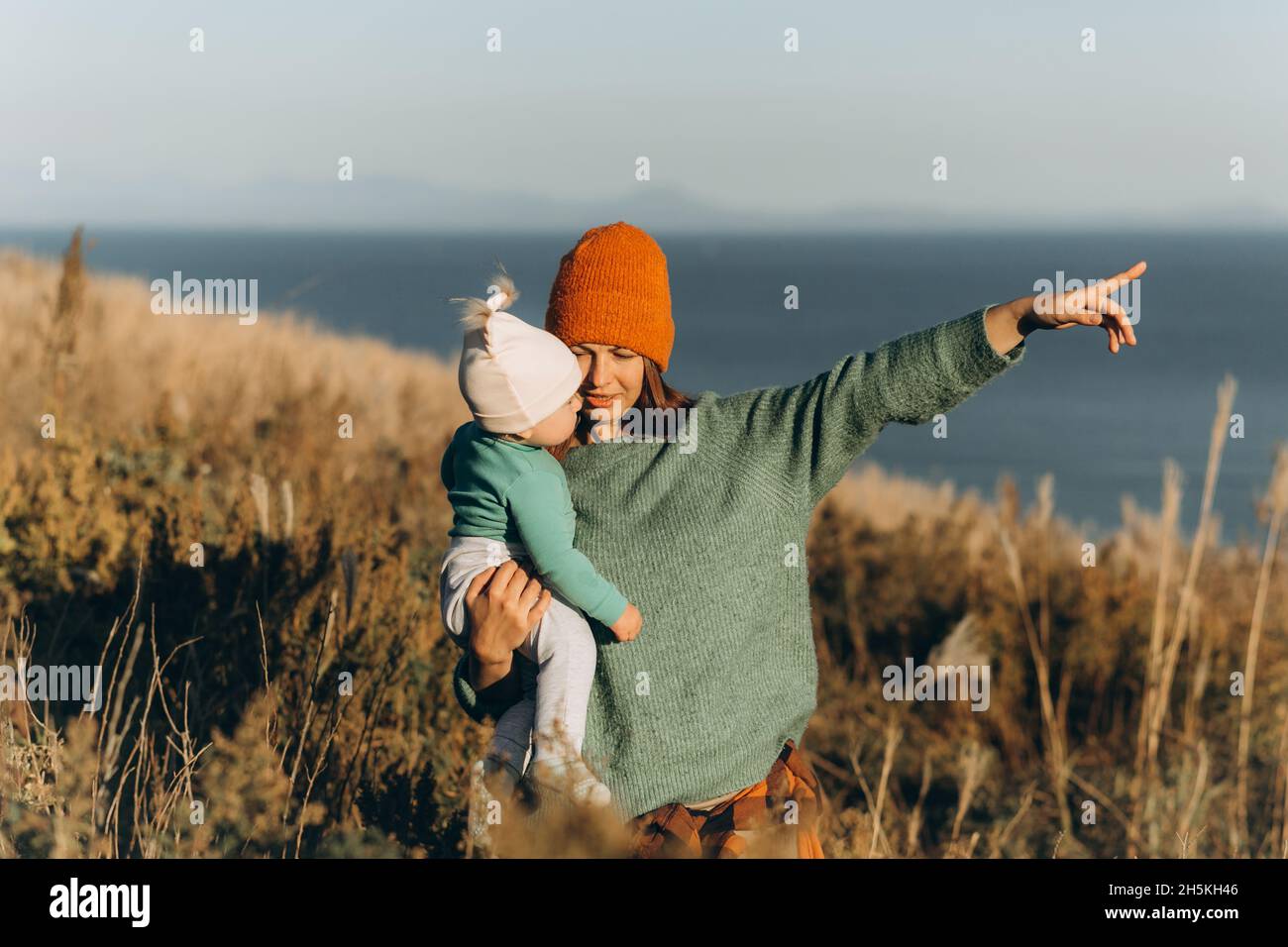 Baby And Mom point a finger Stock Photo - Alamy