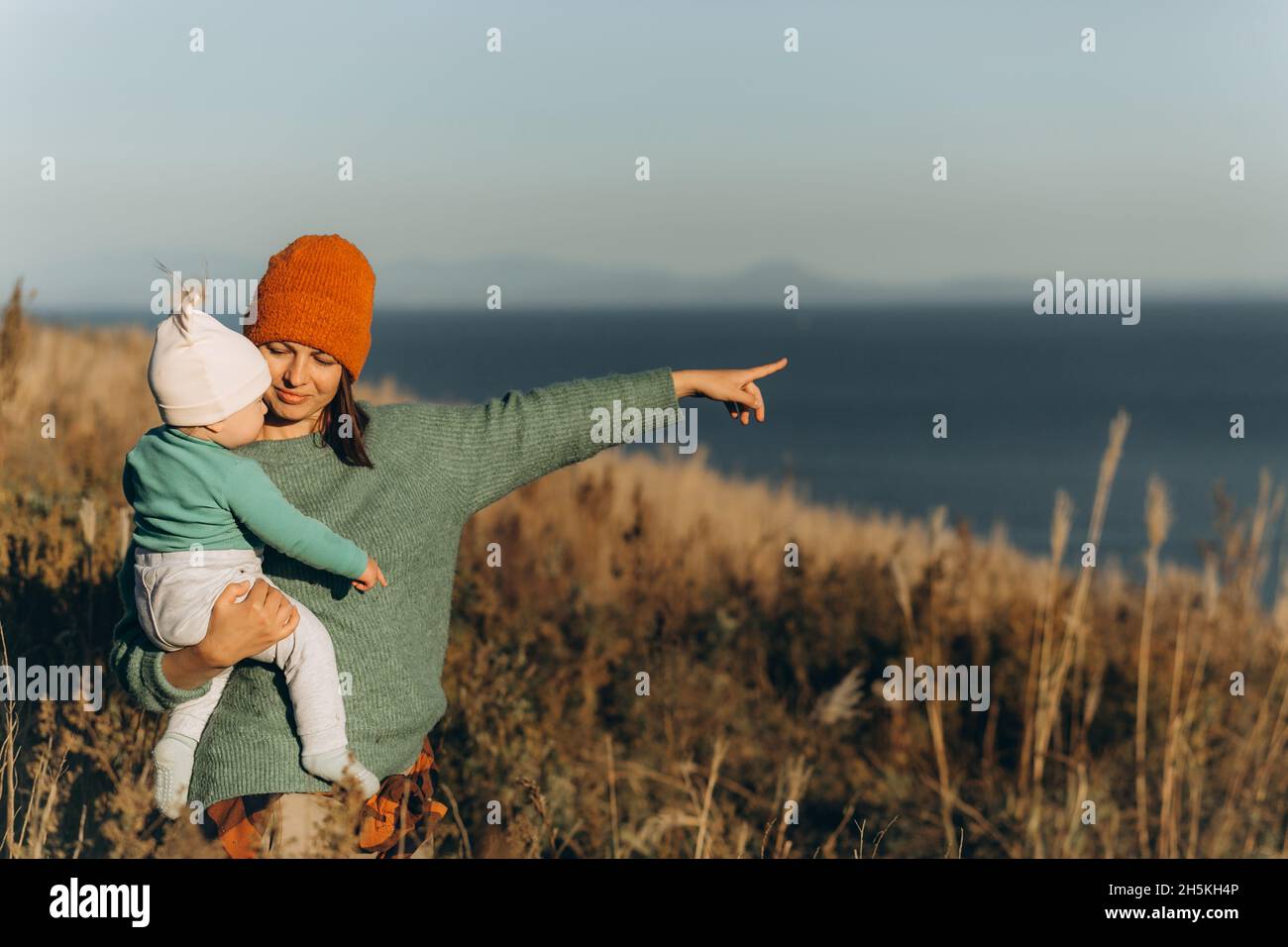 Baby And Mom point a finger Stock Photo - Alamy