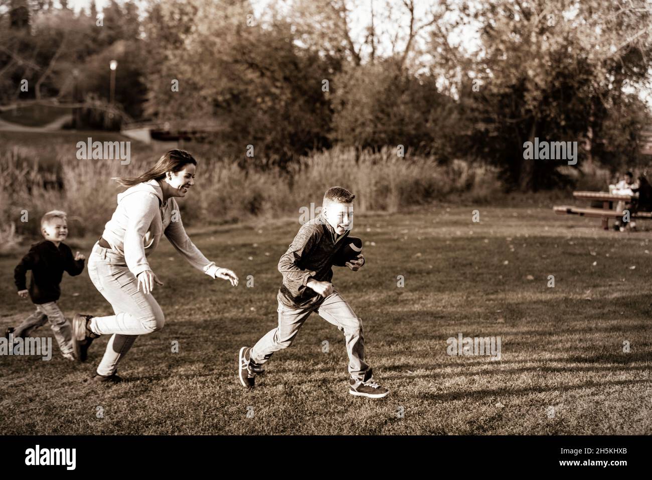 Children chasing football hi-res stock photography and images - Alamy