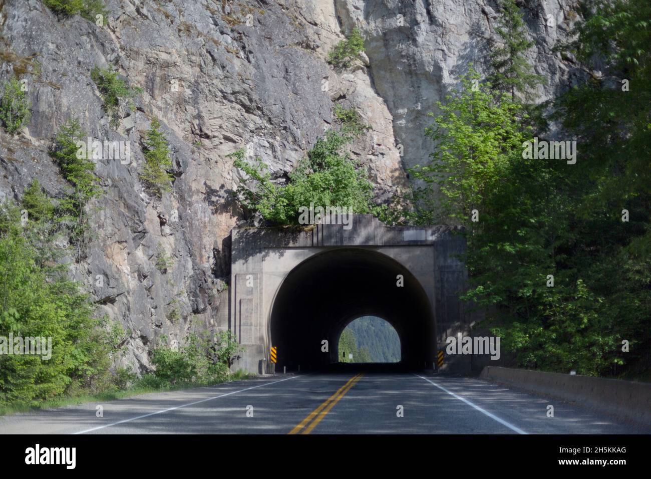 Tunnel on a two lane highway through a mountain in the Coast Mountains ...