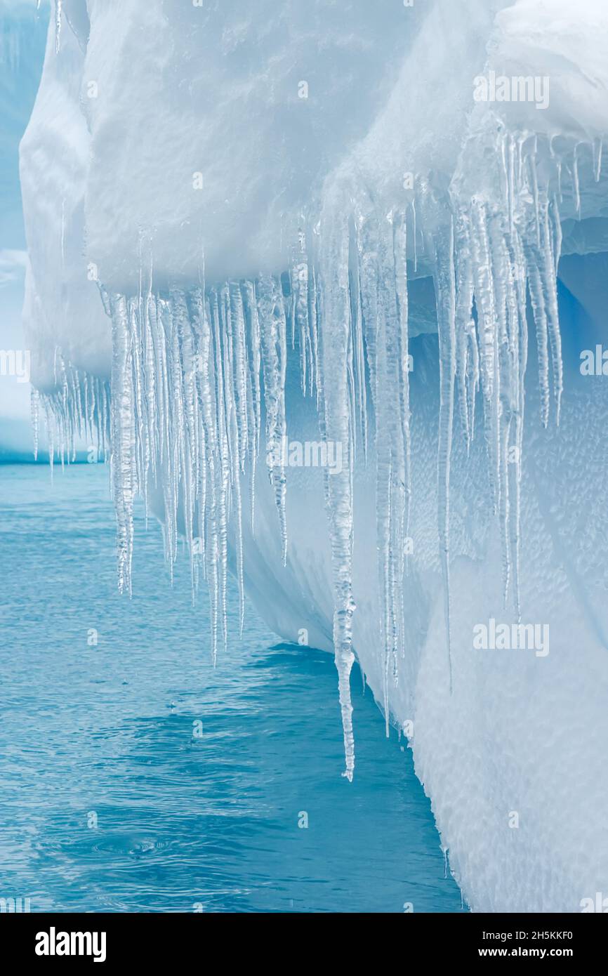 Icicles hanging from an iceberg Stock Photo - Alamy