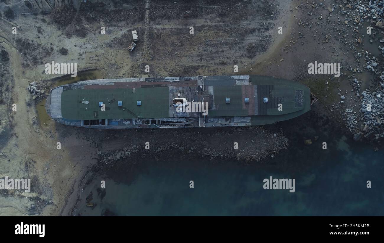 Top view of abandoned ship. Shot. Mysterious view of old ship washed up ...