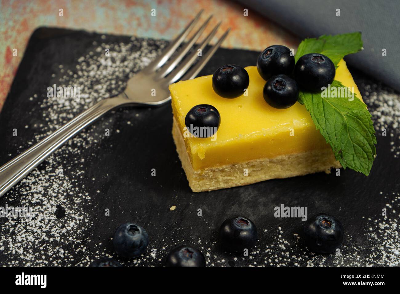 One Portion of homemade lemon curd cake in the shape of an ingot or ...