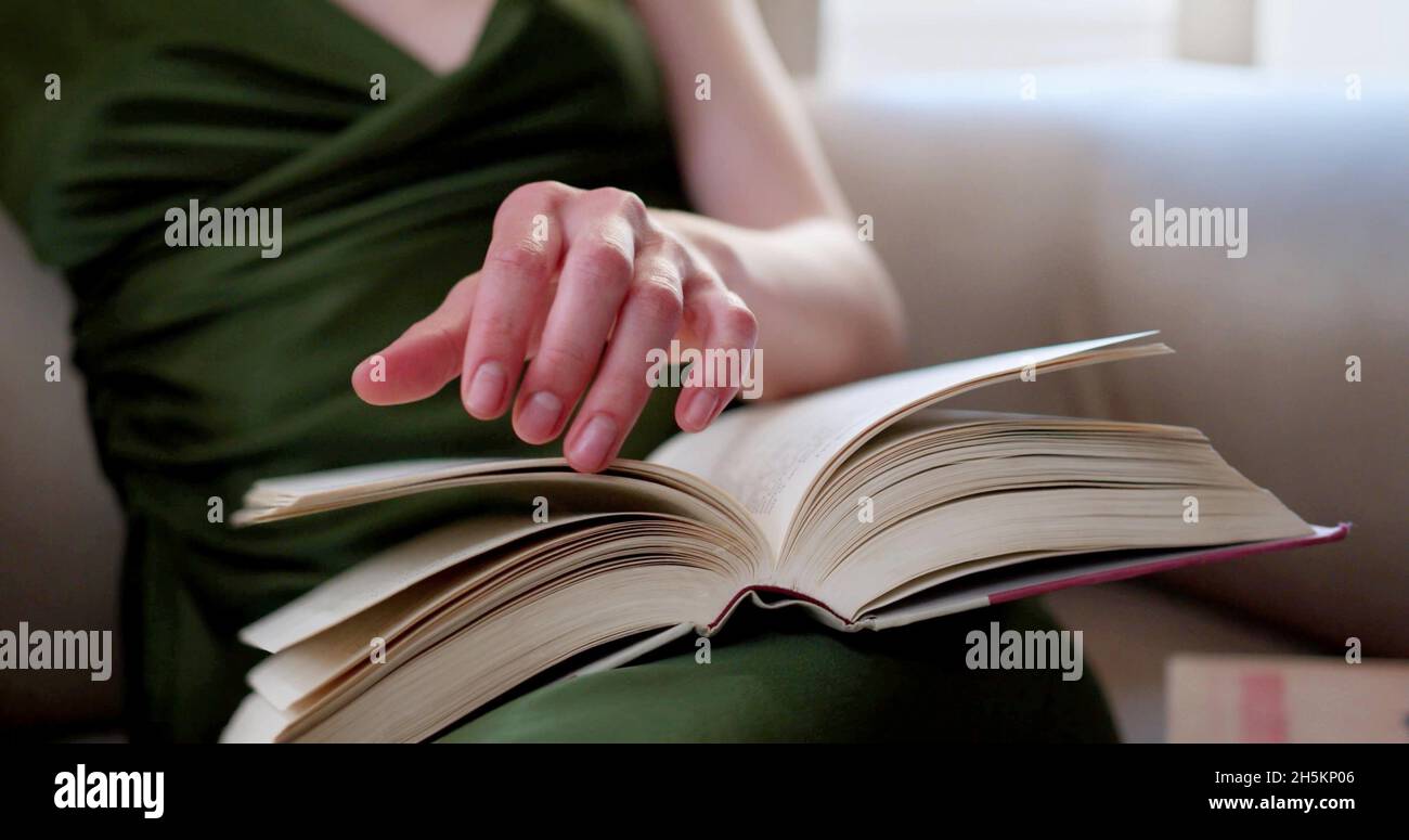 A woman is reading a book Stock Photo - Alamy