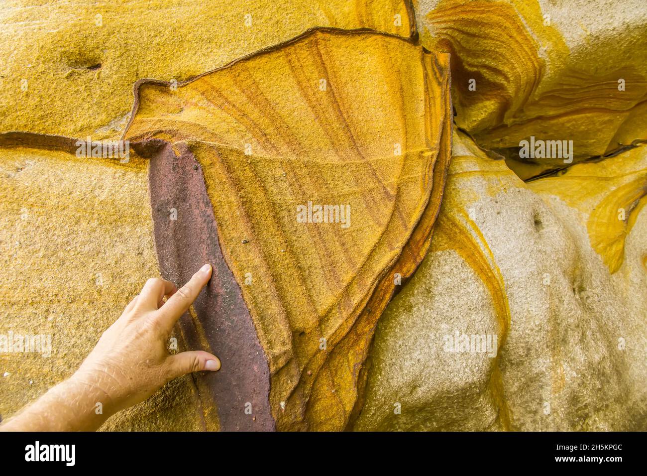 A hand points to sandstone formations Stock Photo - Alamy