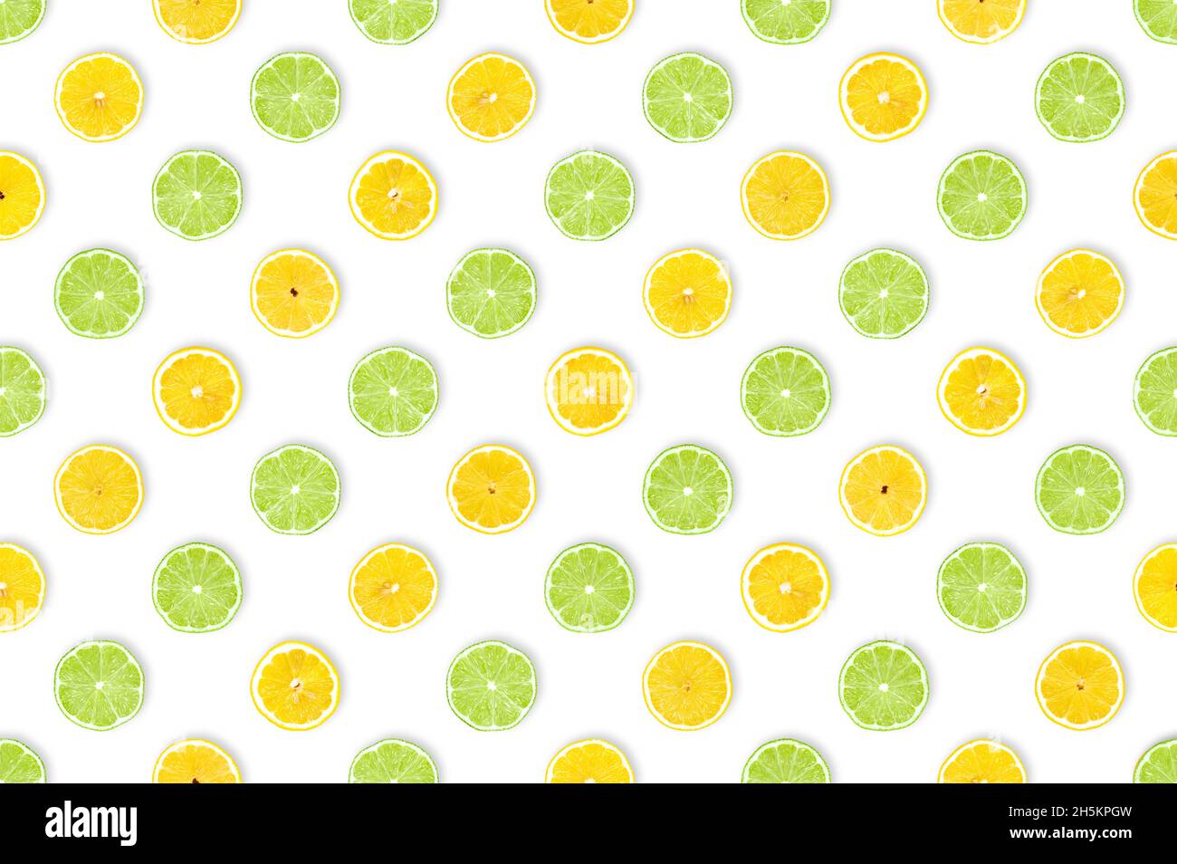 Lemon meets lime: healthy fruits background. Pattern of freshly cut ...