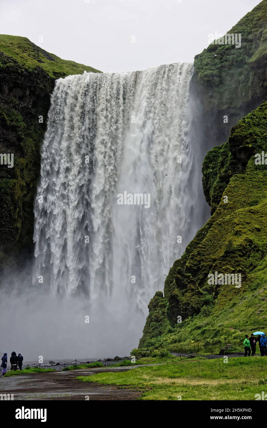 Seljalandsfoss waterfall plunging 60m from the cliff above, Sudhurland ...