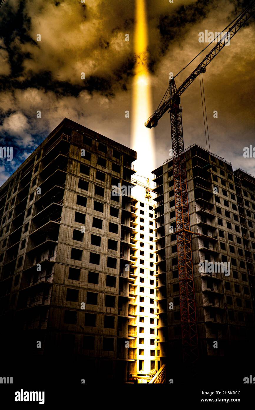 Vertical shot of the alien UFO beam hitting high buildings under ...