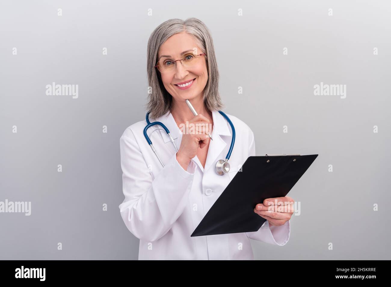 Photo of cute positive senior woman doc dressed white uniform glasses ...