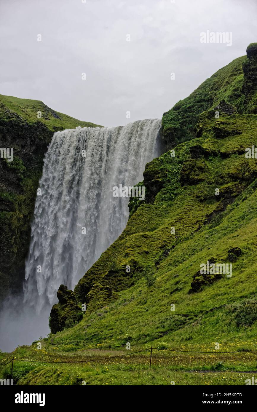 Seljalandsfoss waterfall plunging 60m from the cliff above, Sudhurland ...