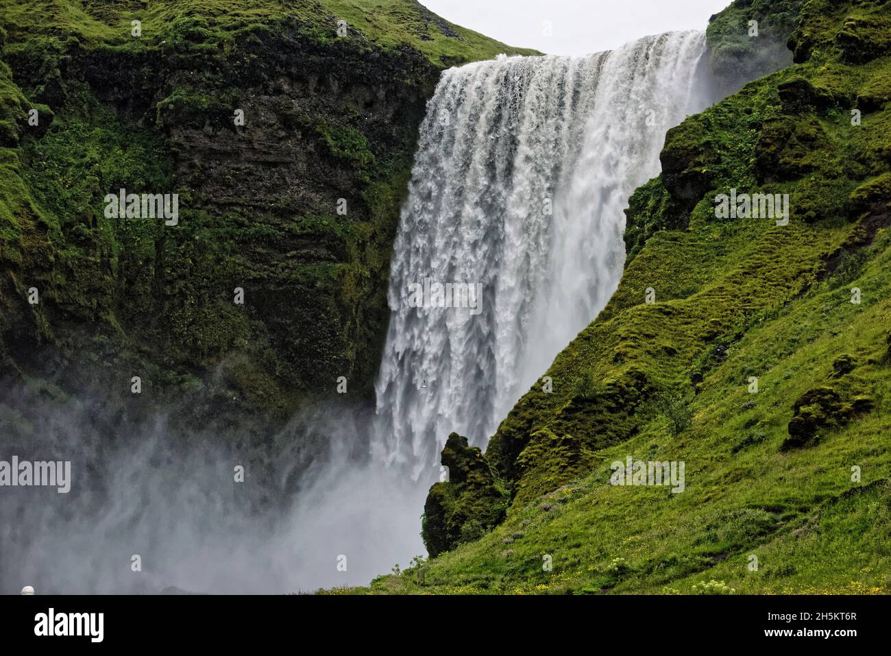 Seljalandsfoss waterfall plunging 60m from the cliff above, Sudhurland ...