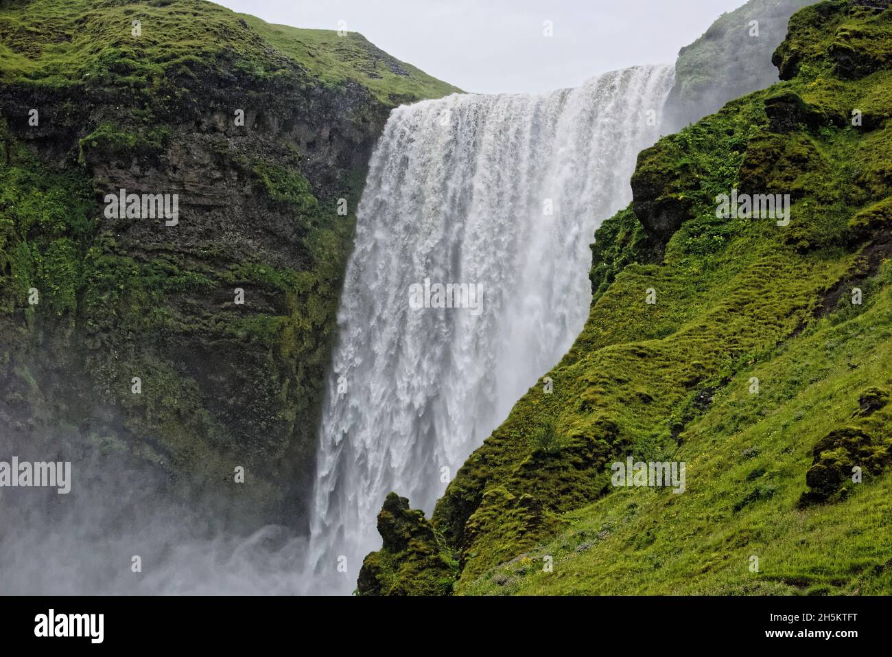 Seljalandsfoss waterfall plunging 60m from the cliff above, Sudhurland ...