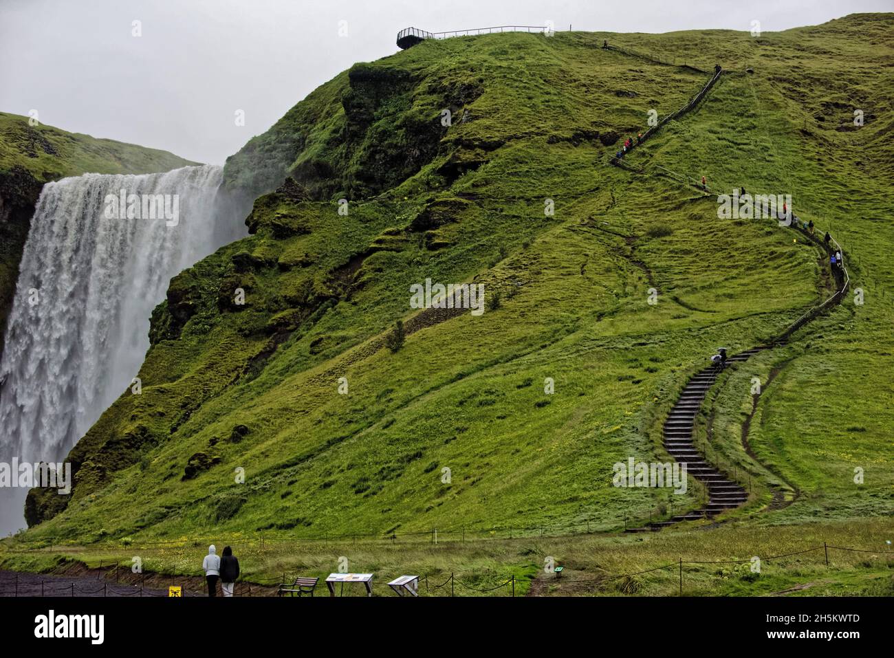 Seljalandsfoss waterfall plunging 60m from the cliff above, Sudhurland ...