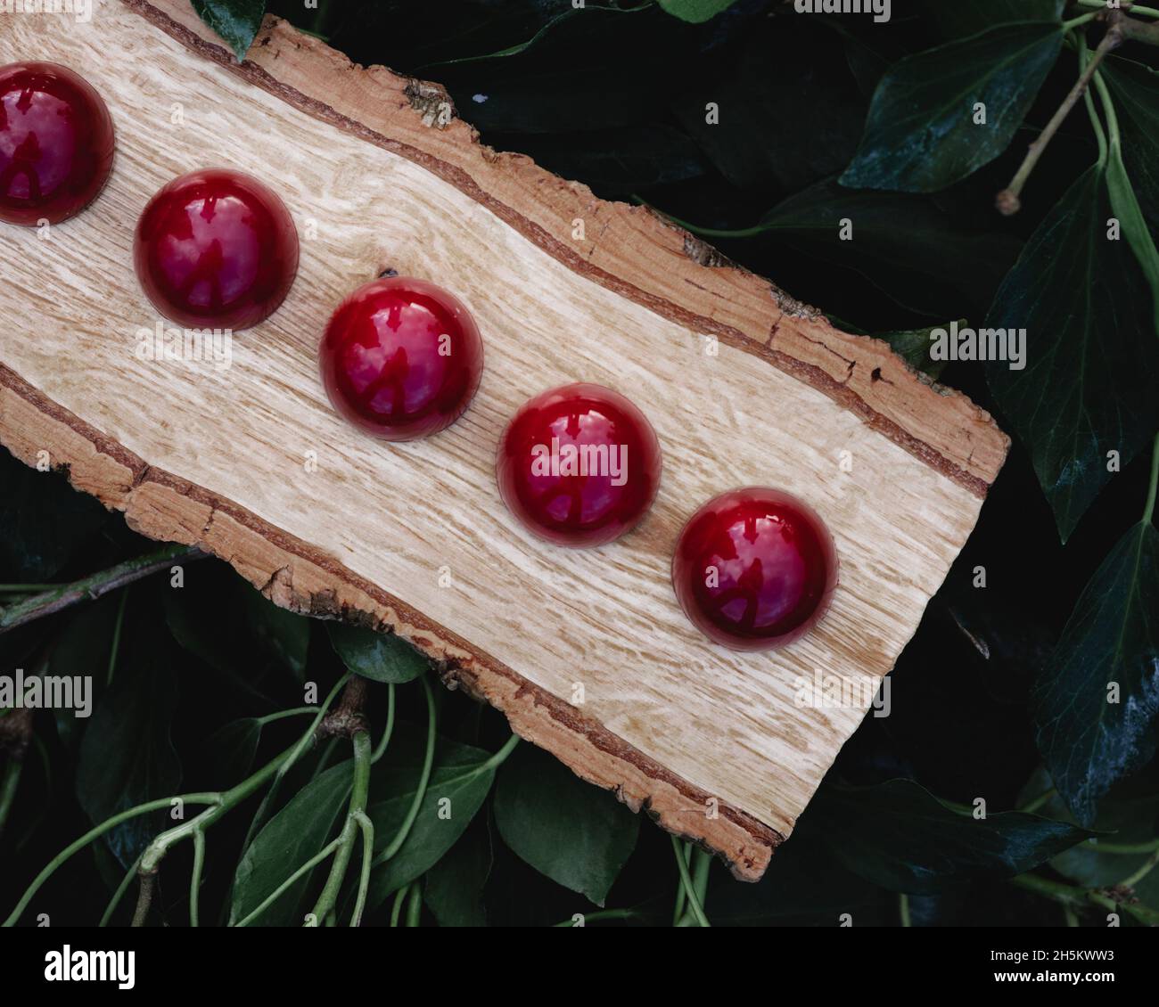 Top view of caramelized red candies on a wood Stock Photo - Alamy