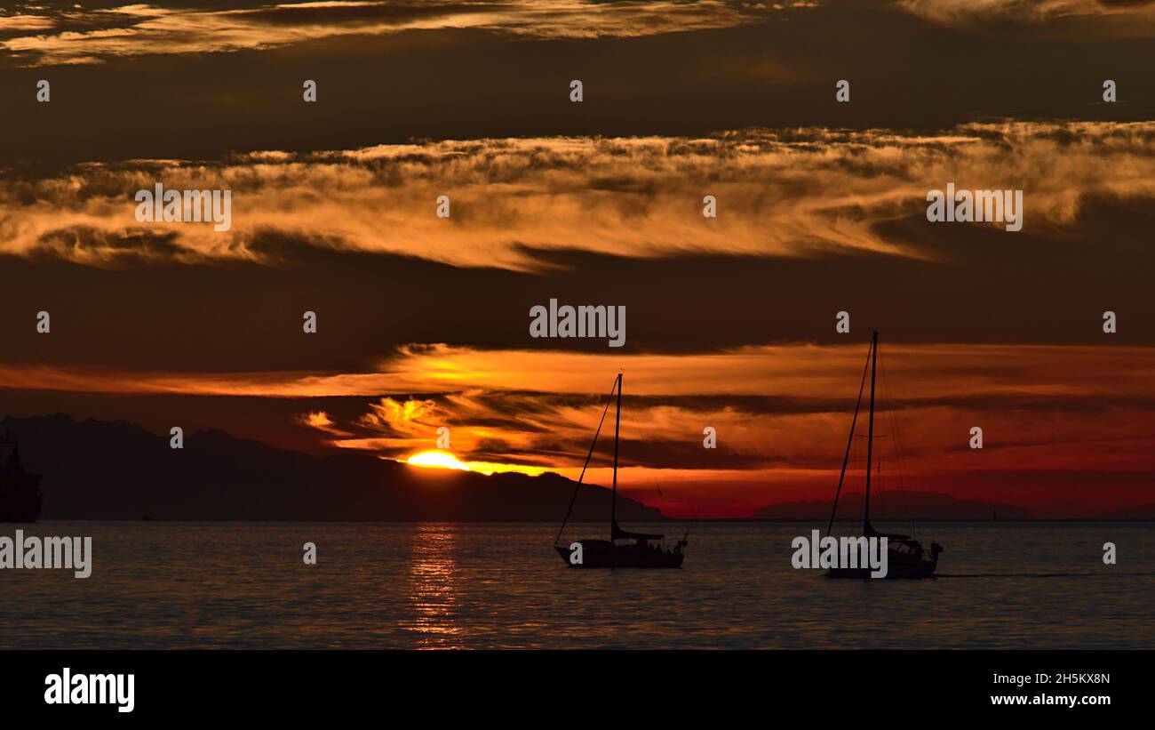 Sunset above the mountains of Vancouver Island on horizon viewed from ...