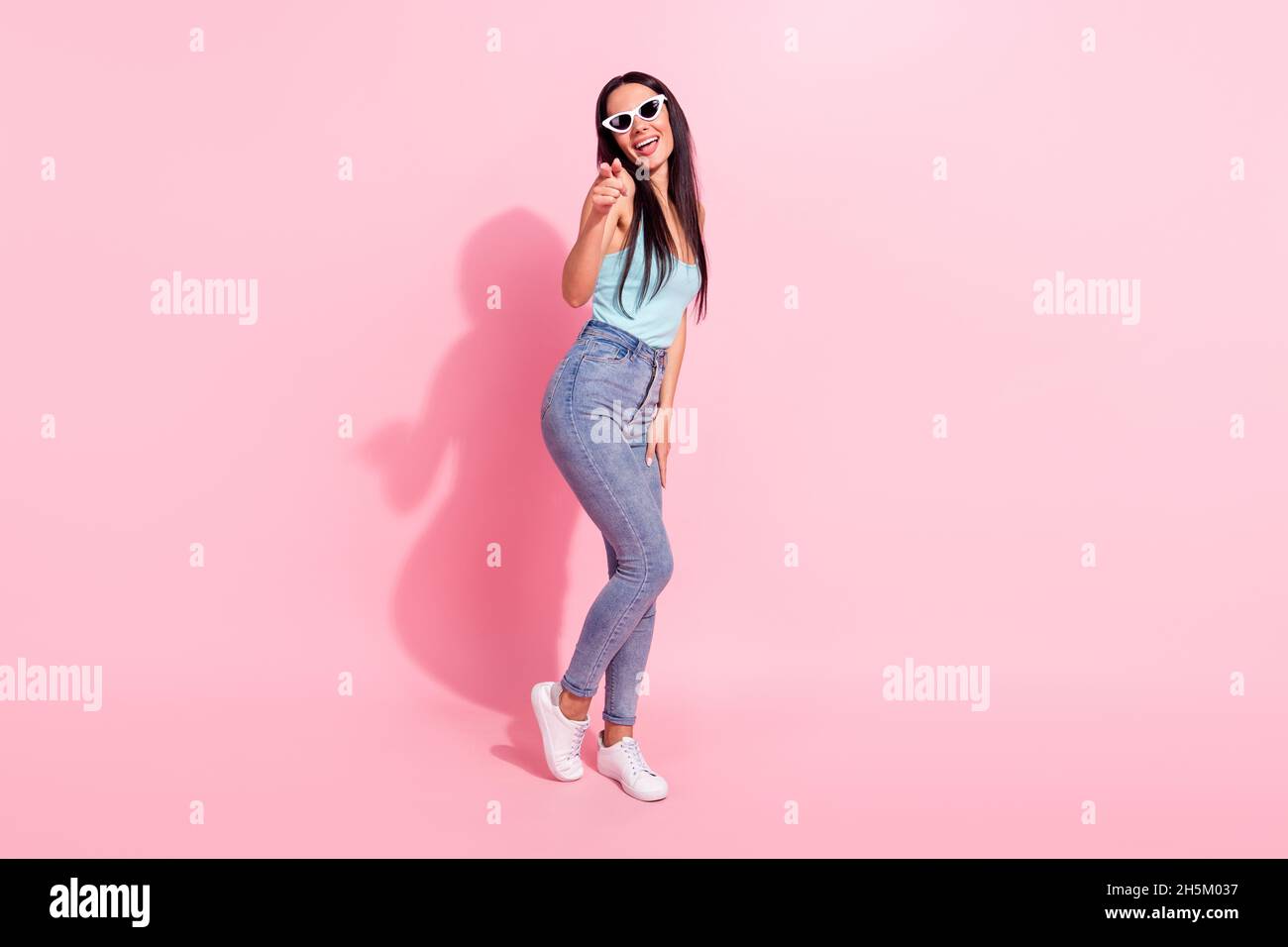Full length body size photo woman in sunglass dancing pointing at you ...