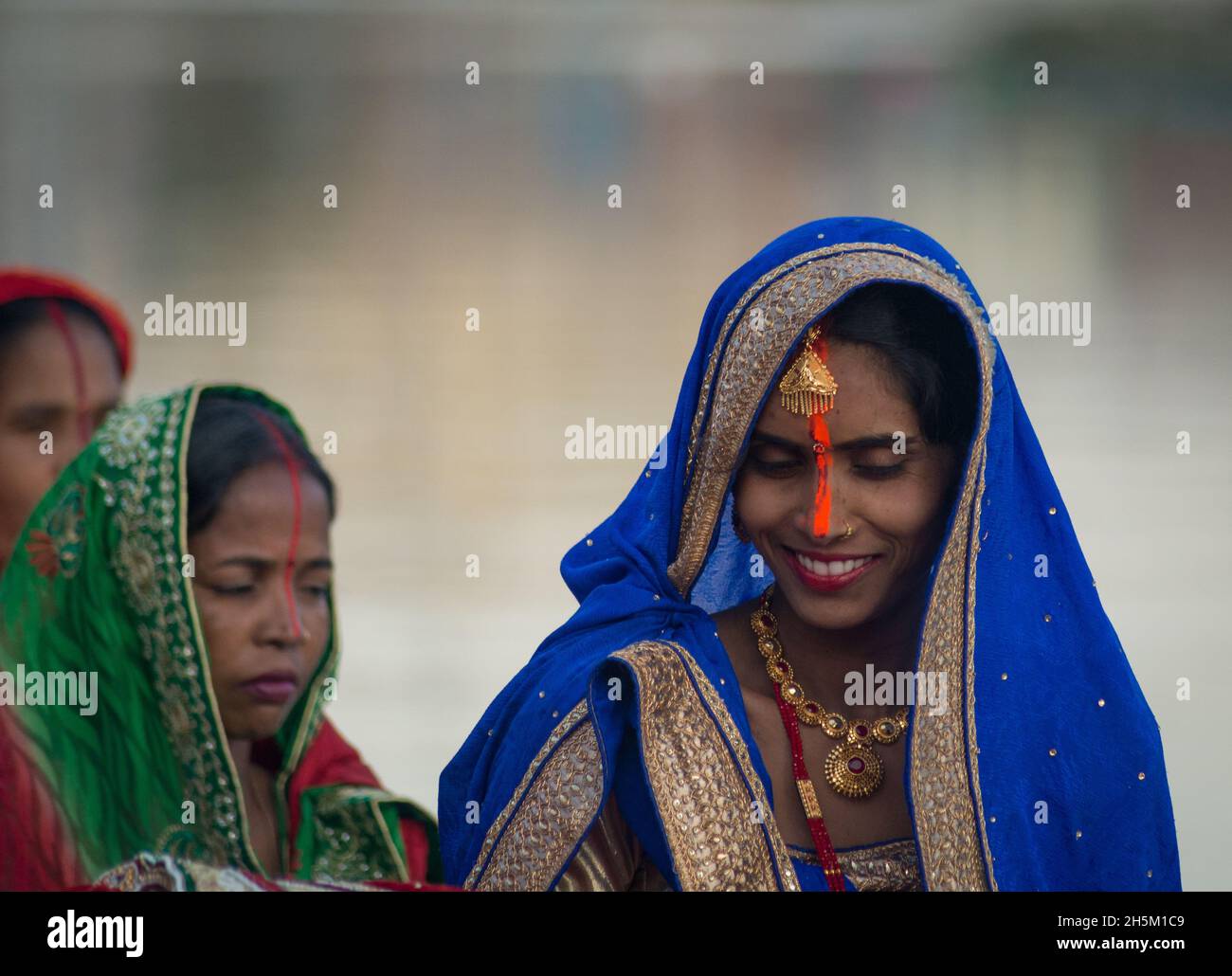 Kathmandu, Nepal. 10th Nov, 2021. A devotee with vermilion tika on her ...