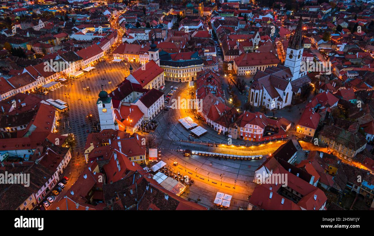 Birds eye view over historic city center of Sibiu, Romania at sunset ...