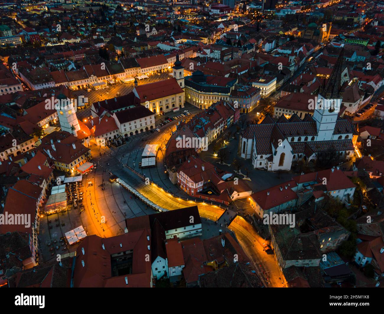 Birds eye view over historic city center of Sibiu, Romania at sunset ...