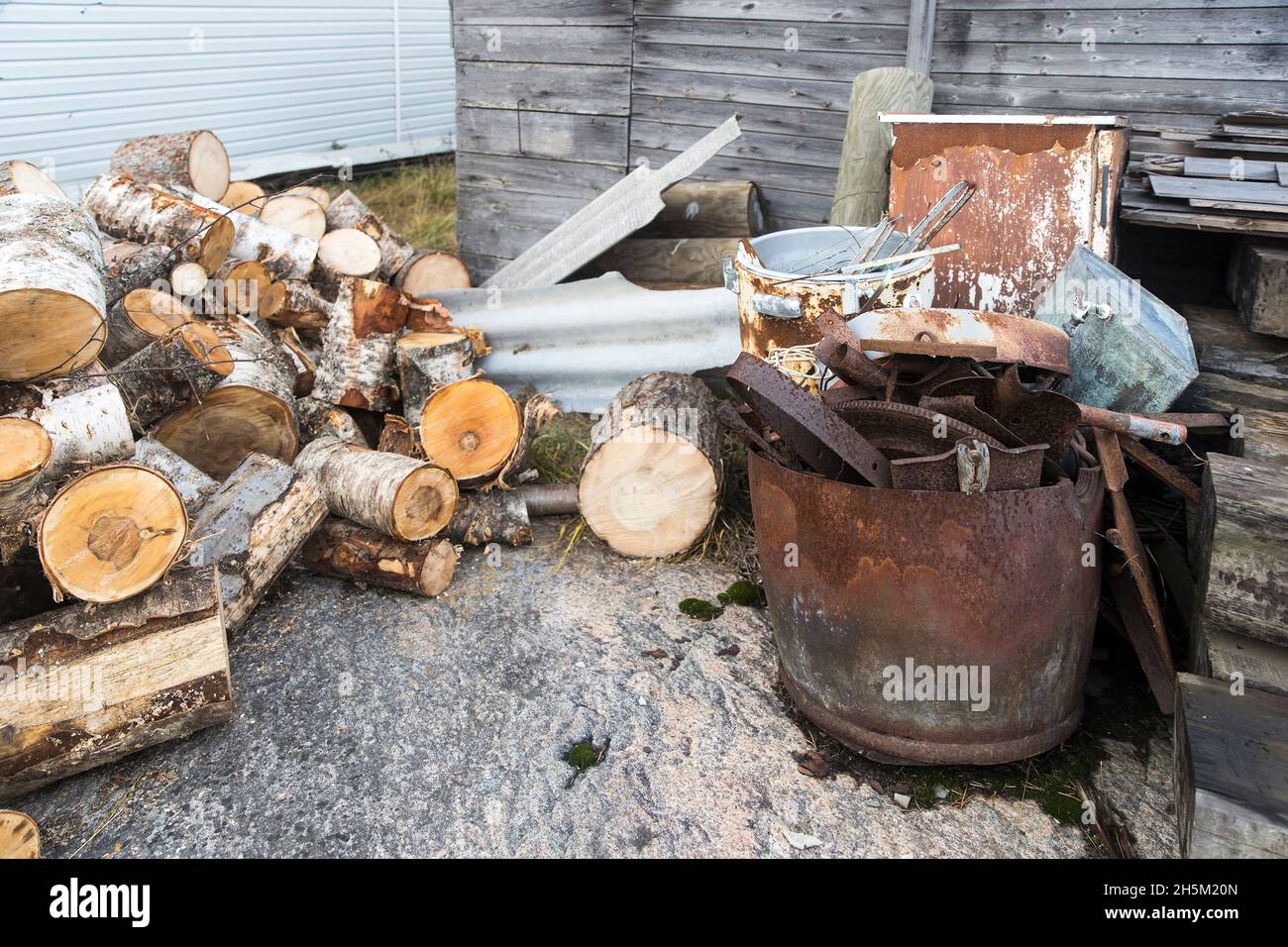 Remains of rusty metal parts exposed outside the territory of a rural ...