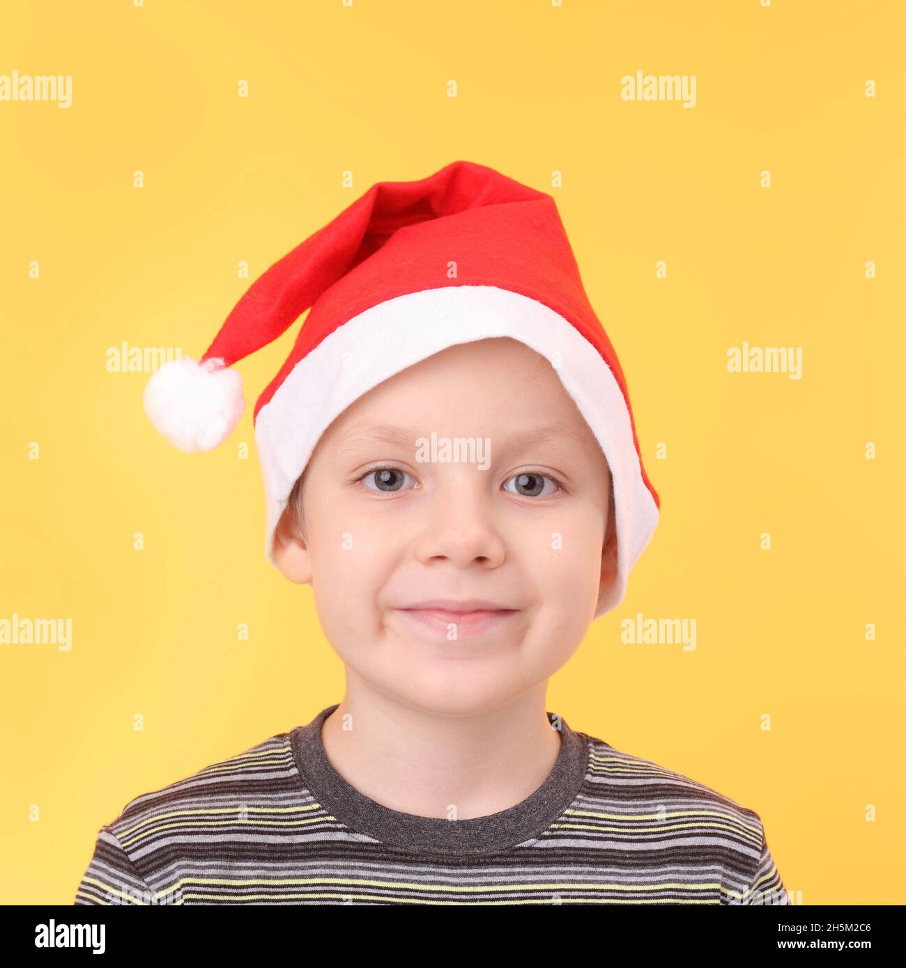 cute little boy wearing Santa Claus cap Stock Photo - Alamy