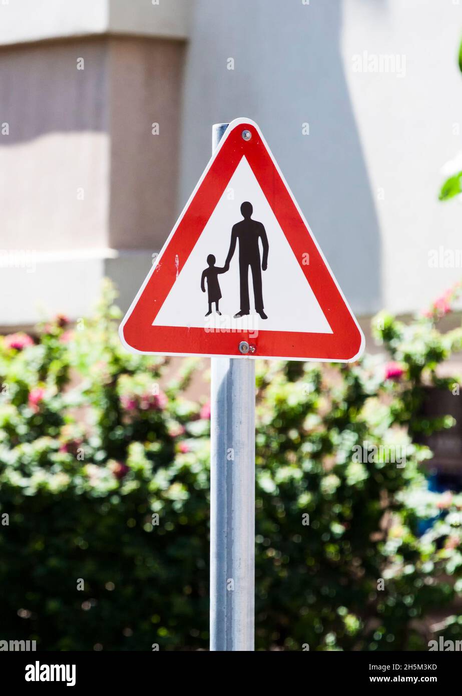 School Safety Zone Roadside Warning Sign - black silhouettes on a white ...