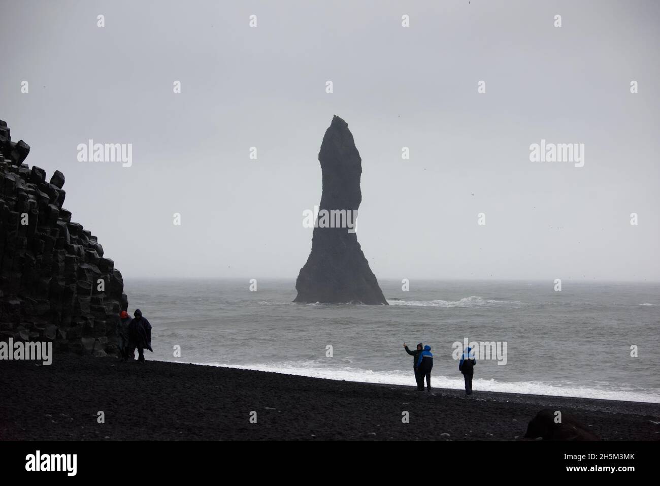 The Reynisdrangar basalt sea stacks and the Reynisfjara black sand ...