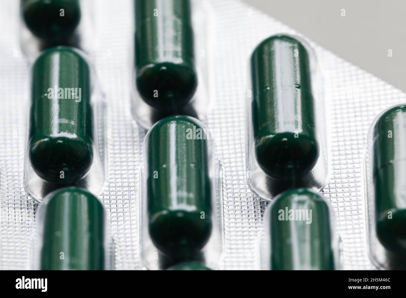 Pack of green pills, close-up photo with selective soft focus Stock ...