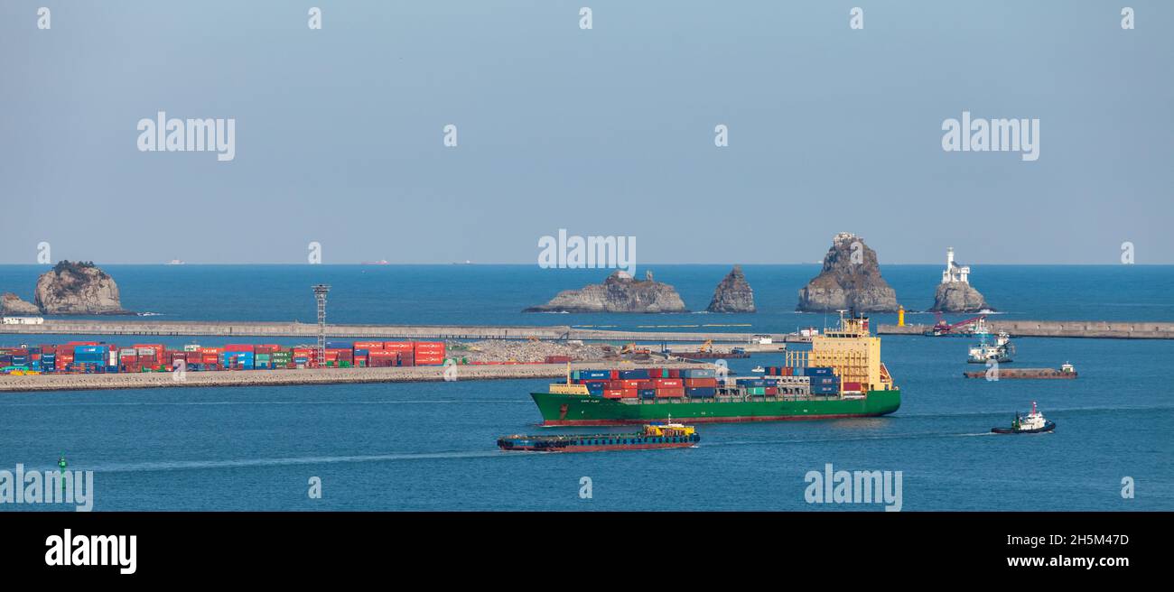 Busan, South Korea - March 22, 2018: Cargo ships are go on Busan bay on ...