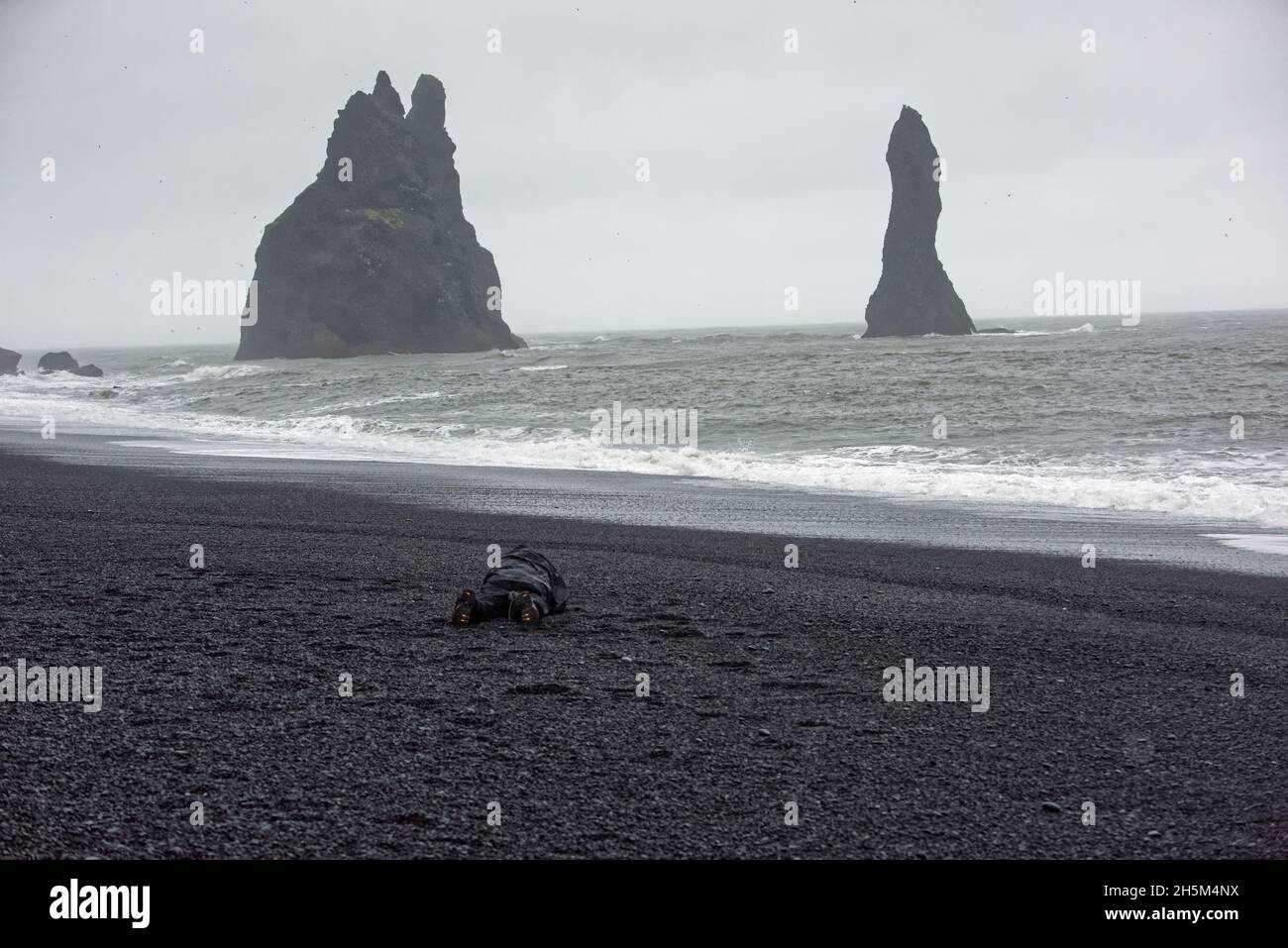 The Reynisdrangar basalt sea stacks and the Reynisfjara black sand ...