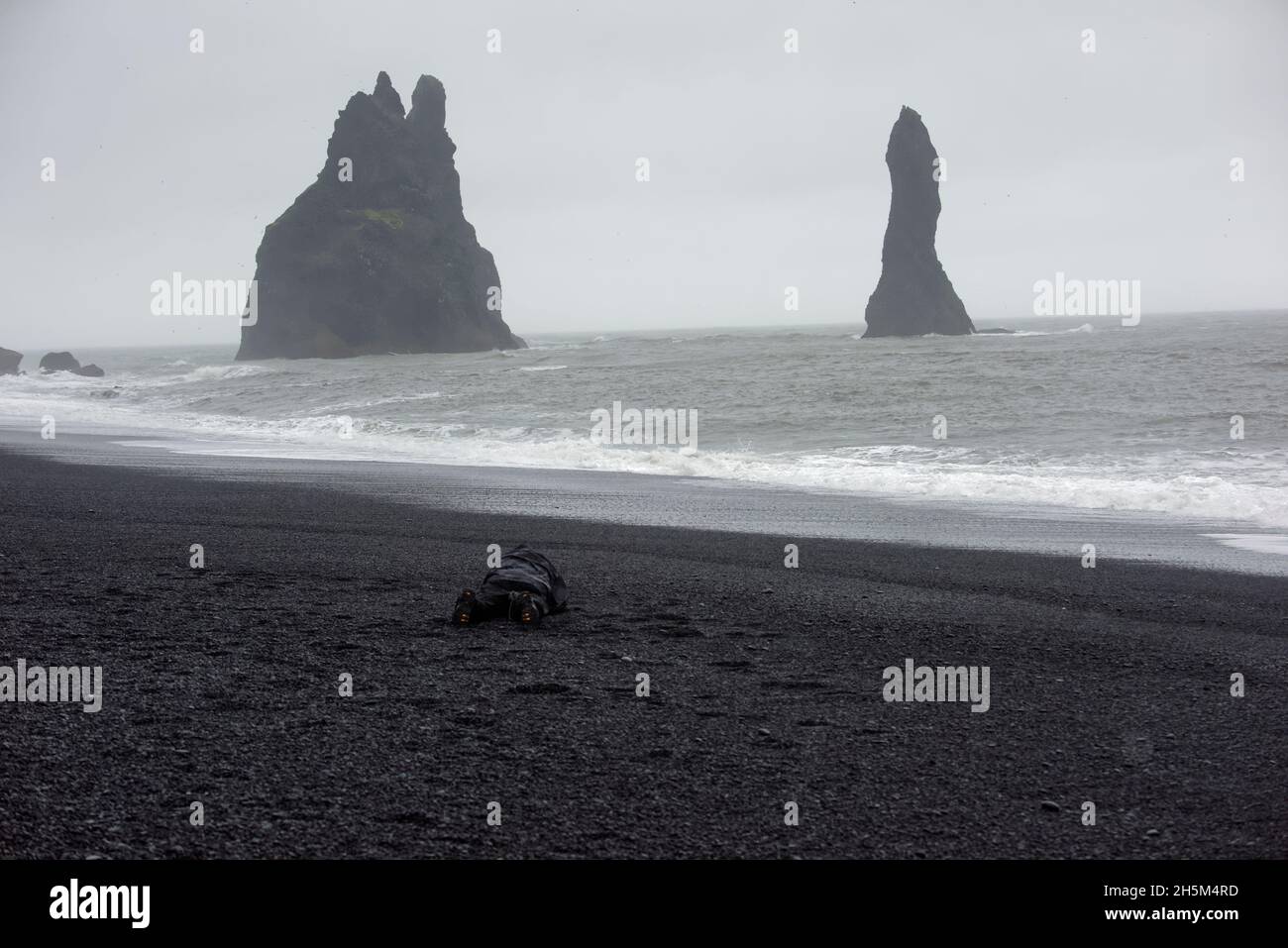 The Reynisdrangar basalt sea stacks and the Reynisfjara black sand ...