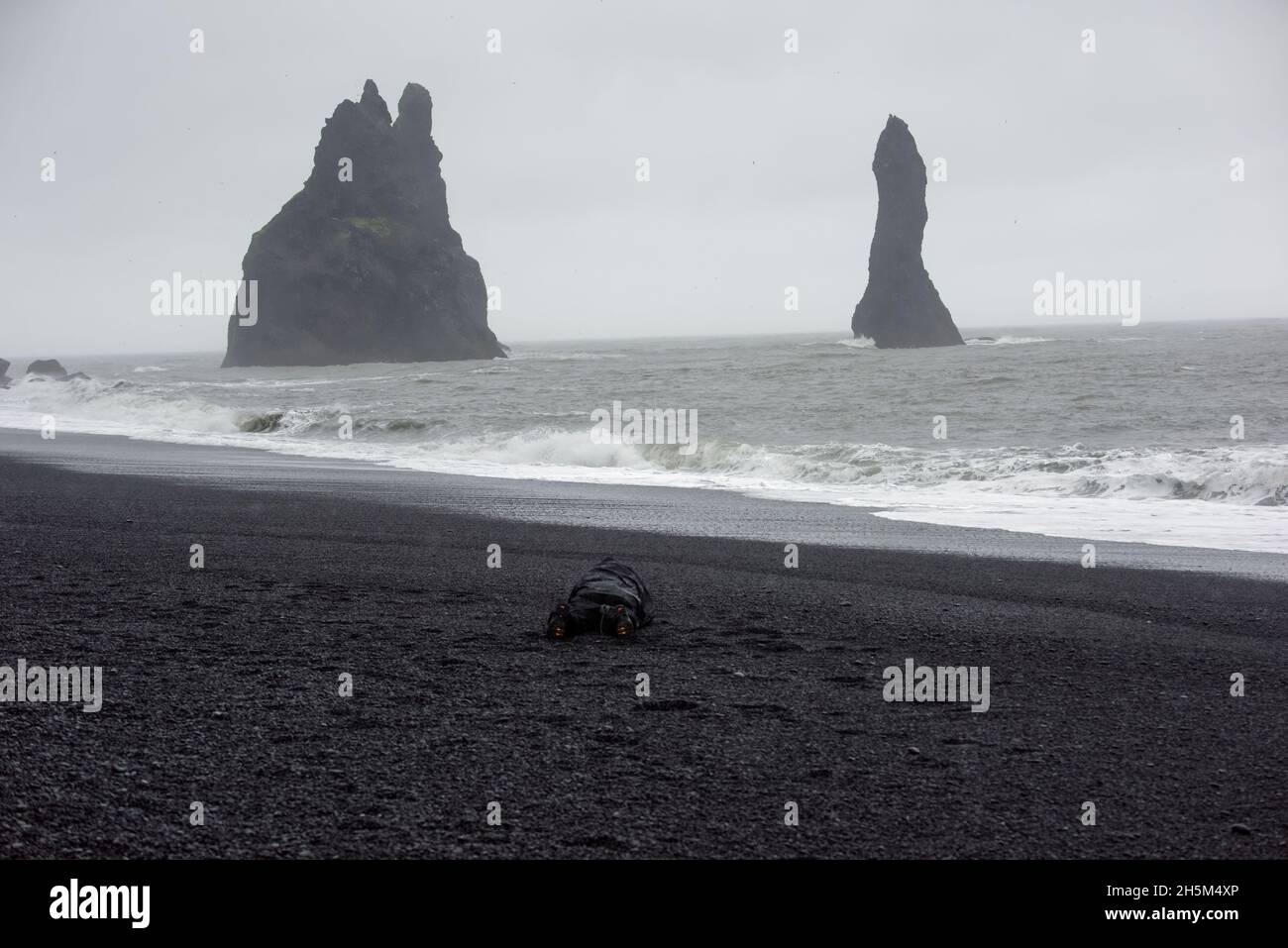 The Reynisdrangar basalt sea stacks and the Reynisfjara black sand ...
